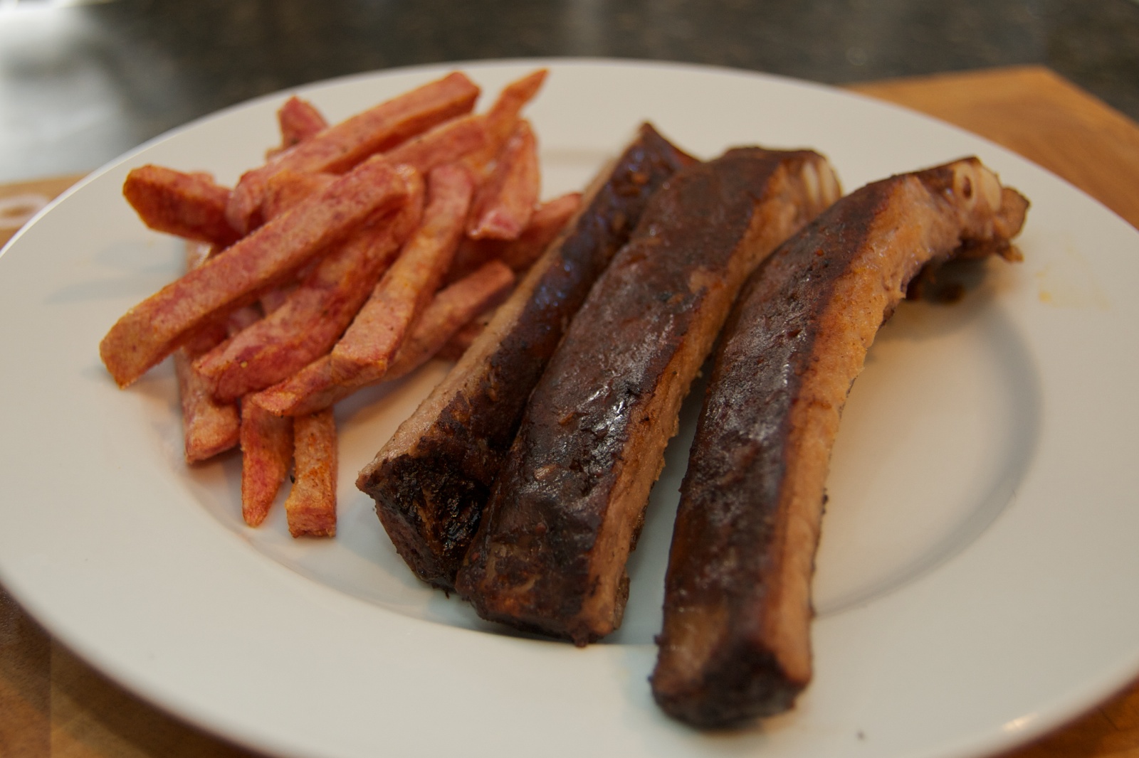 Local smoked barbecue pork spare ribs and hand-cut seasoned red potato ...